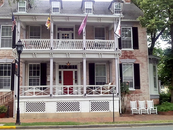 The Bartlett Pear Inn's welcoming porch practically whispers "come sit a spell," a Southern tradition that never goes out of style.