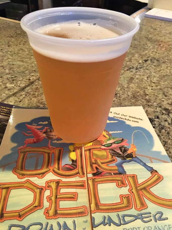 Another cold one stands ready for duty, perched atop the restaurant's colorful coaster&mdash;a small detail that shows they understand the importance of proper beer protocol.