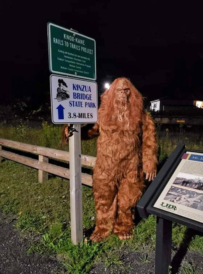 Even Bigfoot can't resist pointing travelers toward Kinzua Bridge State Park, proving that Pennsylvania's natural wonders attract visitors of all species.