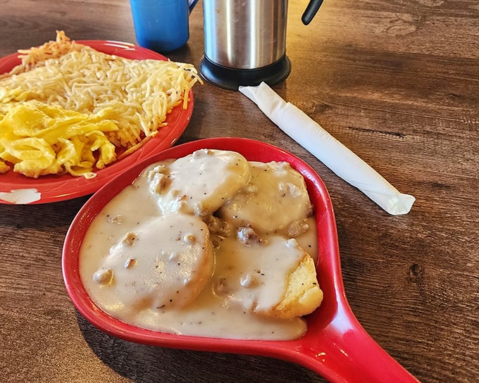 Biscuits and gravy that could make a grown adult weep with joy, served alongside scrambled eggs that know their supporting role.