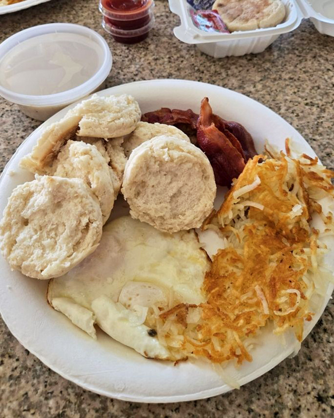 Biscuits so fluffy they might float away if not anchored by eggs, bacon, and those legendary hash browns.