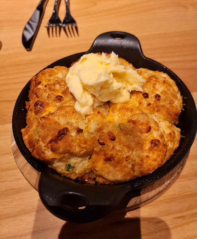 Biscuits that have achieved the impossible trifecta: golden exterior, fluffy interior, and the ability to make you forget all your table manners.