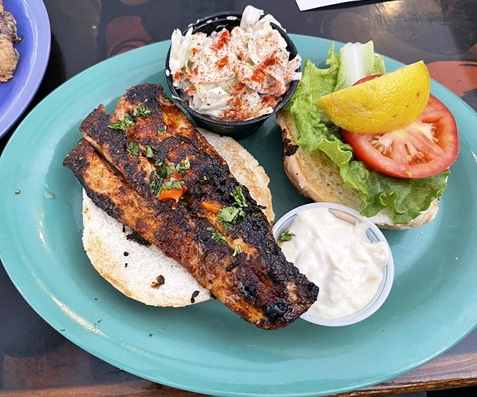 Blackened mahi-mahi sandwich that makes you wonder why you ever settled for ordinary lunch options. That seasoning blend deserves its own fan club. 