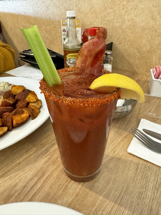 A Bloody Mary that's practically a meal, complete with bacon sentinel standing guard. Celery never had such exciting company.