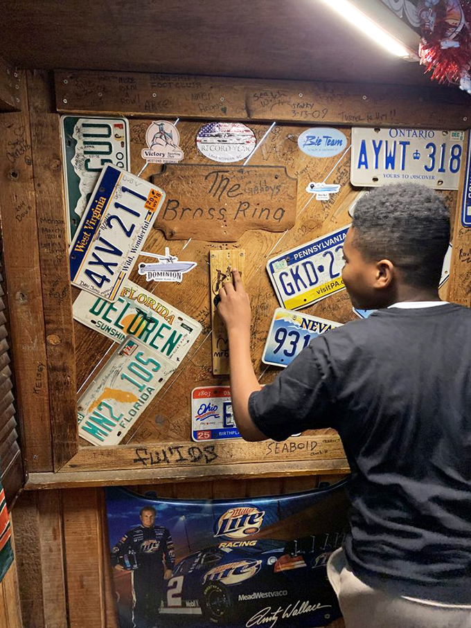 A wall of memories where visitors leave their mark. License plates from across the country tell the story of a dive bar that's become a destination.