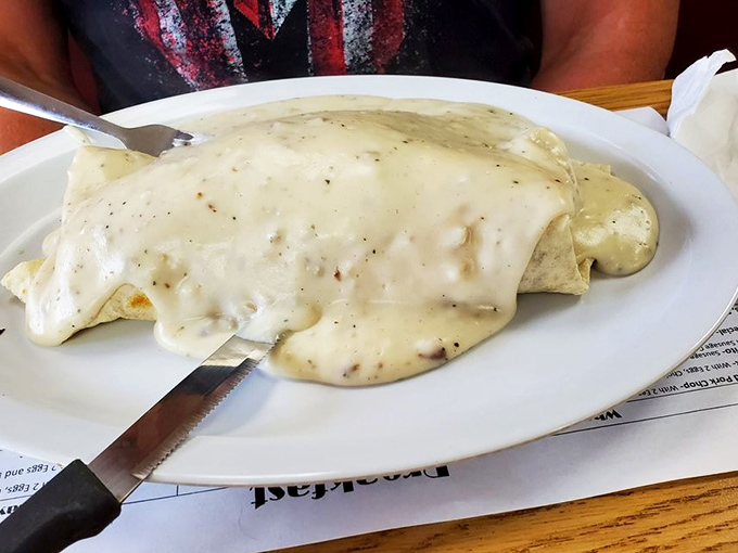Beneath that blanket of country gravy lies breakfast nirvana. Not all heroes wear capes&mdash;some wear a coating of peppery white sauce instead.