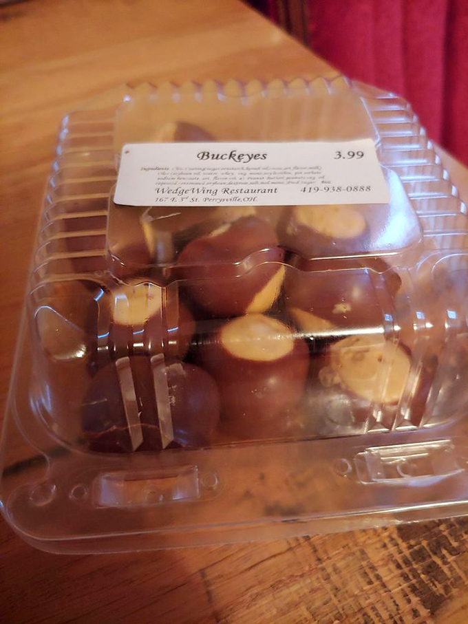 Ohio's state candy in its natural habitat. These chocolate-dipped peanut butter Buckeyes aren't just treats&mdash;they're edible state pride.