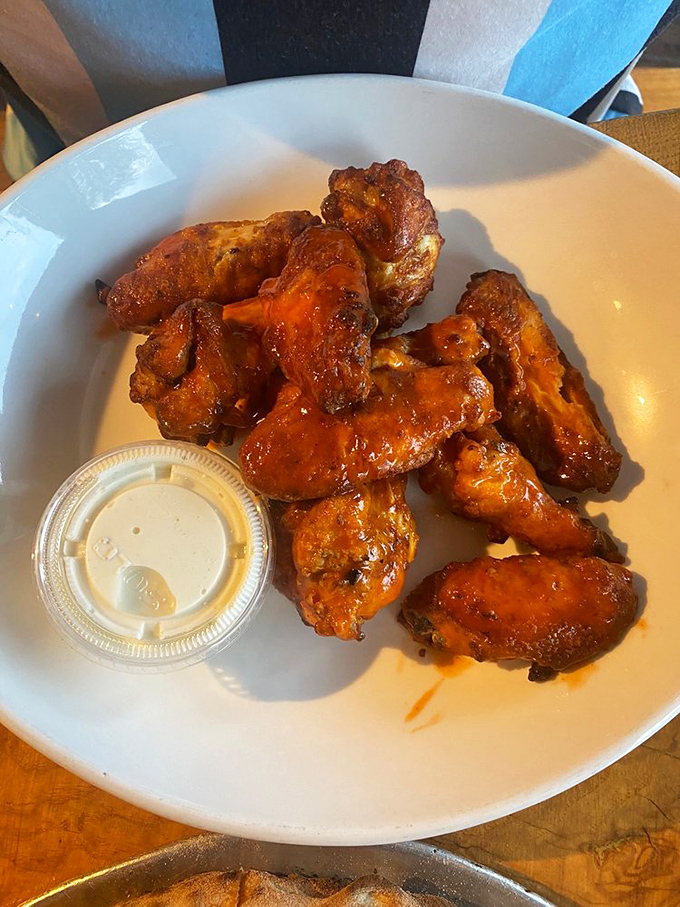 These aren't just wings; they're wood-fired flavor bombs with the perfect sauce-to-crisp ratio that puts sports bars to shame.