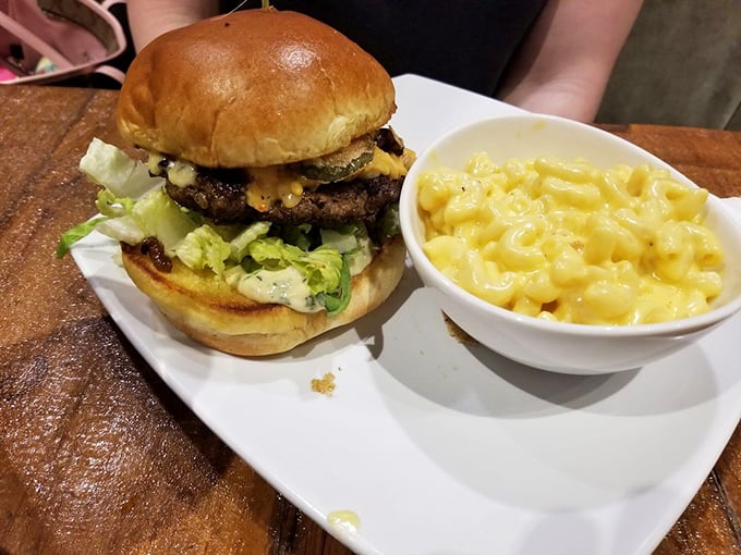 That towering burger paired with creamy mac and cheese proves lunch can be just as show-stopping as breakfast.