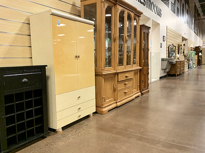 Solid wood cabinets and hutches stand like sentinels of craftsmanship from an era when furniture was built to outlast its owners.