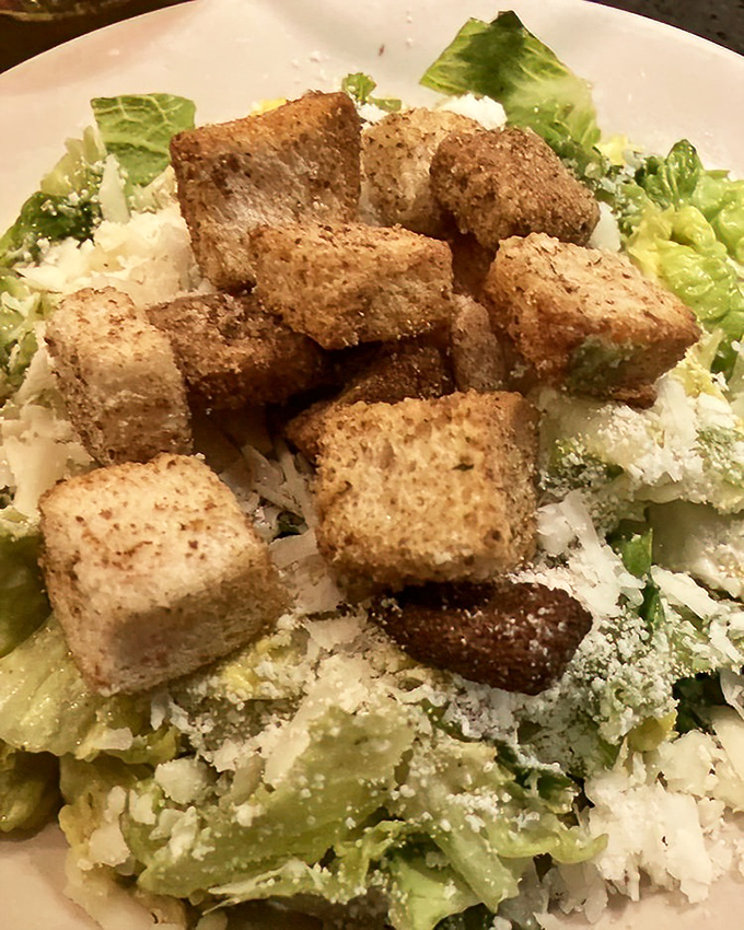 Caesar salad with golden croutons proves even the classics get royal treatment at Spring House.
