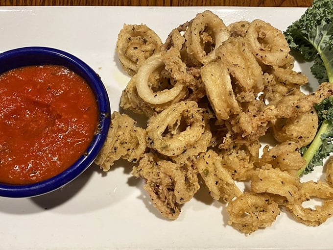 Crispy calamari that puts rubbery bar food versions to shame. These tender rings deserve their own fan club and marinara dipping privileges. 