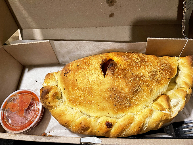 The calzone: pizza's mysterious, folded cousin that keeps its treasures hidden until that first, steam-releasing bite.
