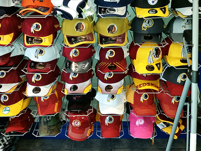 Sports fan paradise! A wall of team loyalty that lets you wear your Maryland pride (or Washington allegiance) on your head.