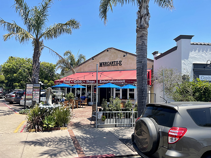 The Capitola Mercantile embodies California's indoor-outdoor lifestyle, where shopping and dining spill onto sun-dappled patios framed by tropical foliage.