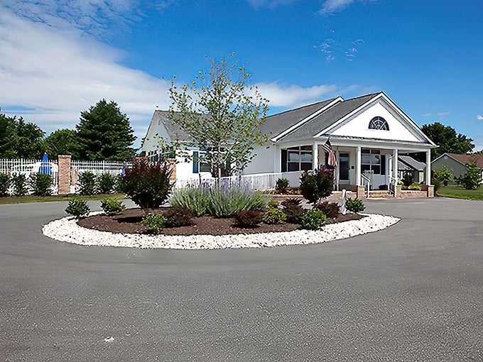 The community center welcomes residents with thoughtful landscaping and a design that says "come in and stay awhile" rather than "hurry up and leave."
