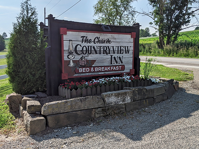 The Charm Countryview Inn sign promises exactly what travelers to Amish Country seek &ndash; a peaceful night's sleep with a side of pastoral beauty.