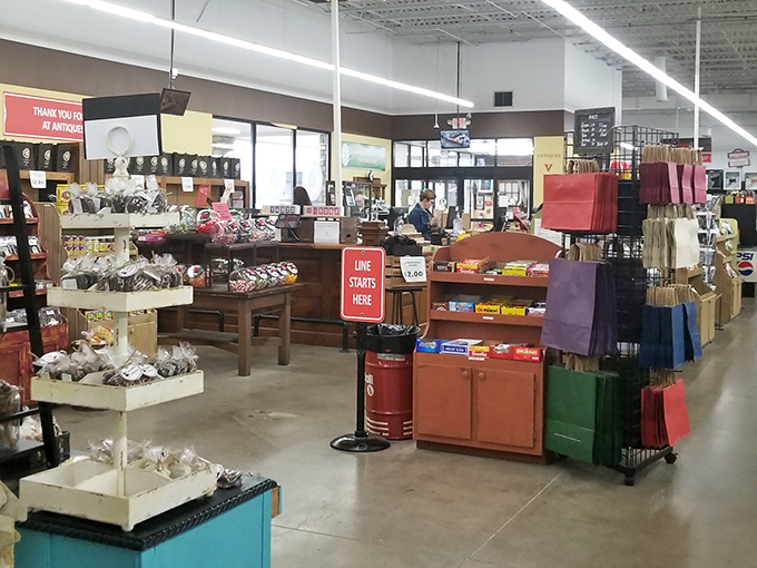 The checkout area offers one last chance to add impulse treasures to your haul. That "Line Starts Here" sign has witnessed countless excited discoveries.
