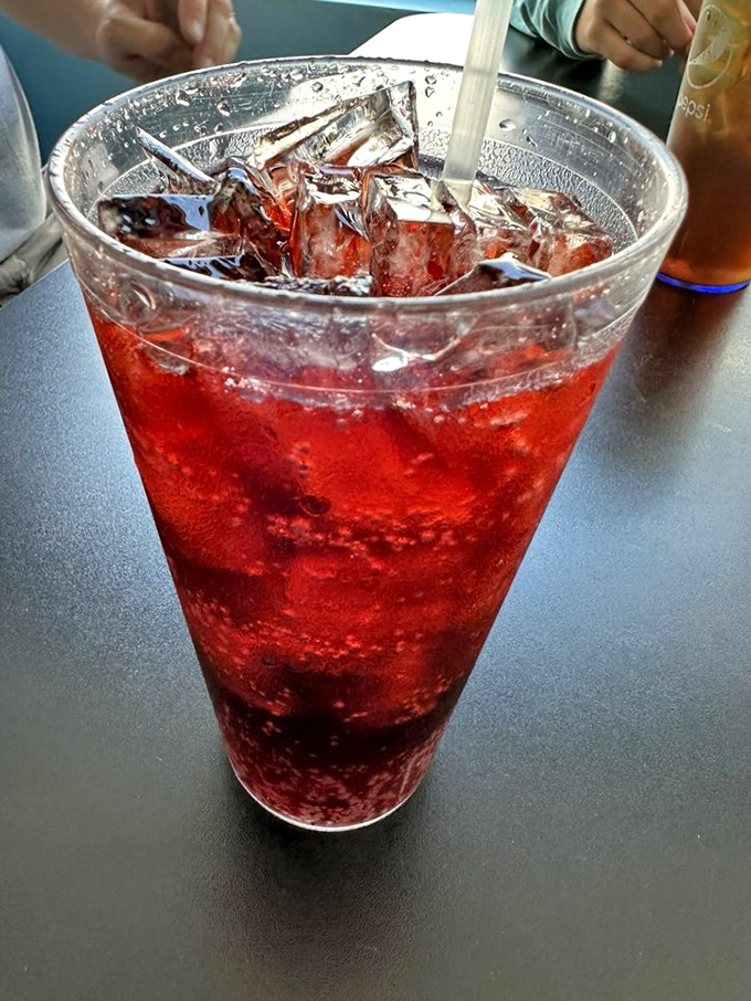 That ruby-red Cheerwine soda, North Carolina's liquid treasure &ndash; bubbling with ice in a glass tall enough to make your troubles look small.