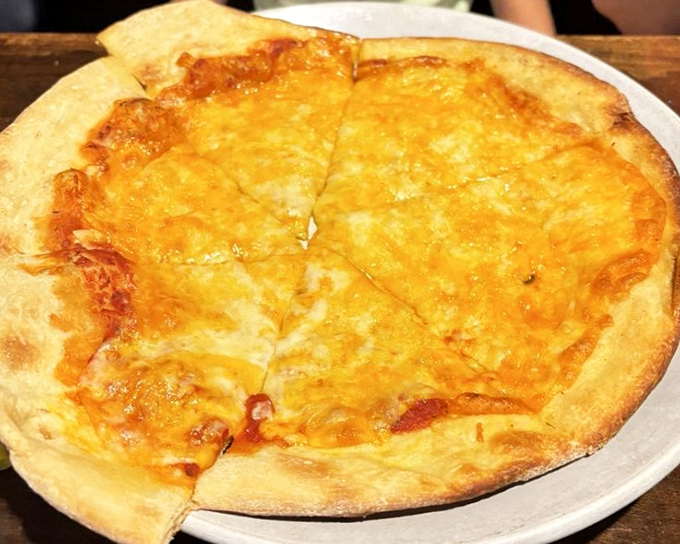 Cheese pizza that reminds you why classics became classics. That golden crust has the kind of crackle that makes your ears as happy as your taste buds.