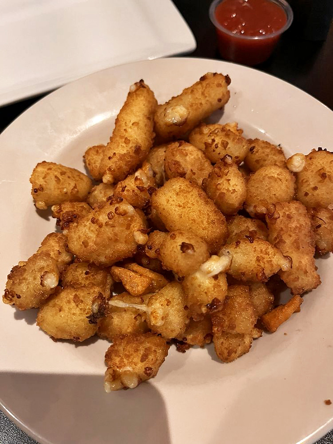 These cheese curds aren't just fried&mdash;they've been transformed into crunchy, molten-centered flavor bombs that disappear faster than you'd admit.