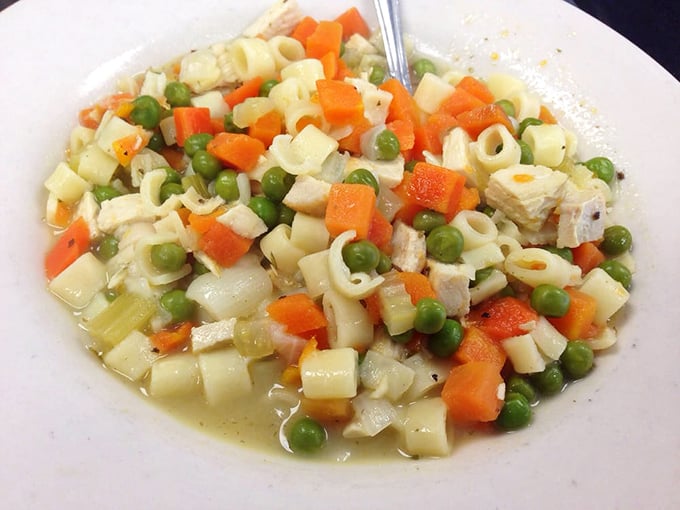 Chicken noodle soup that looks like someone's grandmother climbed through the kitchen window and made it with love and secret ingredients.