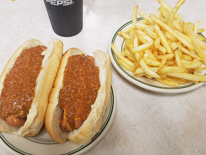 The dynamic duo that's worth the drive. Two perfectly sauced dogs flanked by crispy fries&mdash;a plate that defines Pennsylvania comfort food.