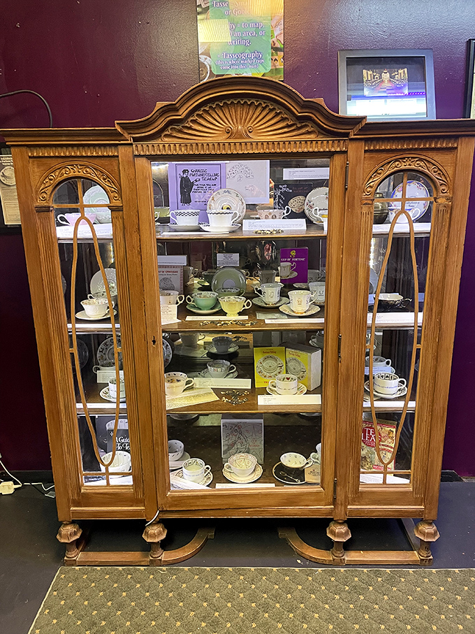 This elegant wooden cabinet displays delicate teacups used for tasseomancy&mdash;fortune-telling through tea leaves. Your grandmother's china suddenly seems rather ordinary by comparison.