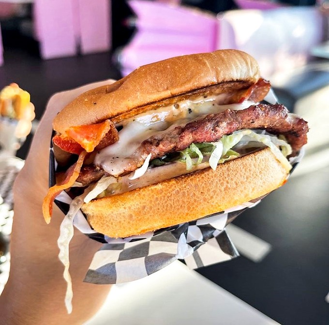 This burger doesn't just satisfy hunger &ndash; it conquers it. Melted cheese cascades over bacon and beef in a symphony of savory perfection.