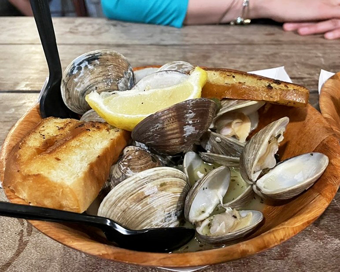 Steamed clams in their natural glory&mdash;swimming in garlicky broth with grilled bread standing by for the inevitable dipping frenzy.
