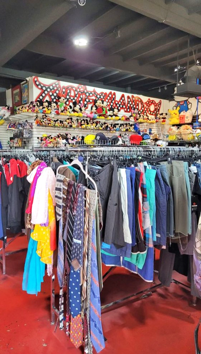 Beneath the watchful eyes of Mickey, racks of vintage treasures await their second chance at fashion greatness.