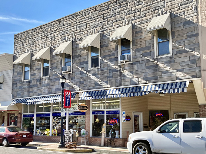 The Clutter Box antique store, with its classic awning and inviting storefront, tempts visitors to hunt for yesterday's treasures in today's charming setting.
