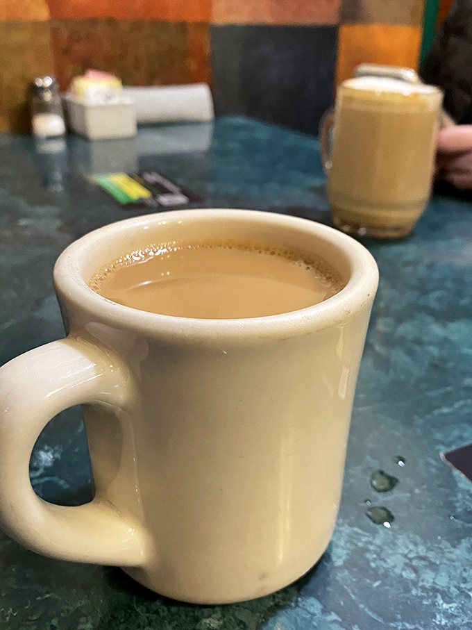 The humble diner coffee mug—delivering liquid motivation in ceramic form. Simple, sturdy, and filled with the elixir of morning possibility.