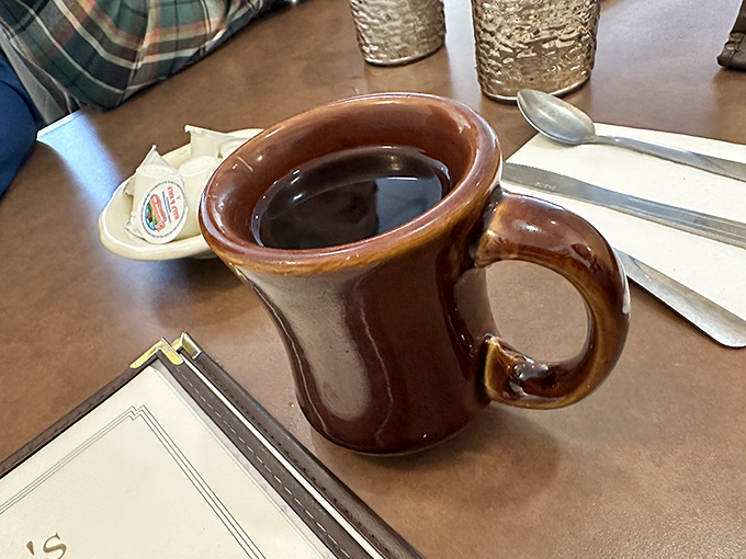 The coffee arrives in a sturdy mug that says, "I'm not here for Instagram &ndash; I'm here to properly caffeinate you for the pie decisions ahead."