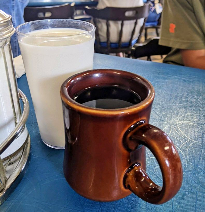 The classic diner duo &ndash; coffee in a sturdy brown mug and milk in a tall glass. Simple pleasures that somehow taste better here.
