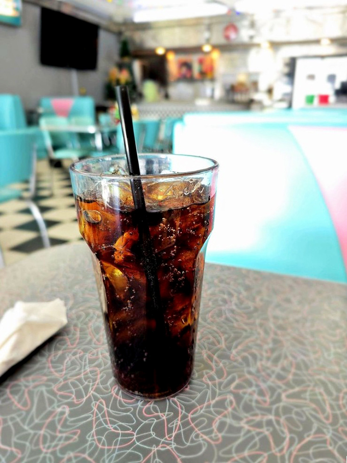 Even the cola arrives in proper diner style, complete with ice and that satisfying fizzy perfection.