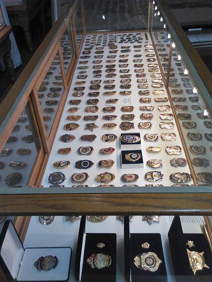 Beyond bicycles, the museum houses an impressive collection of police badges, showing the connection between early cycling clubs and the development of traffic enforcement.