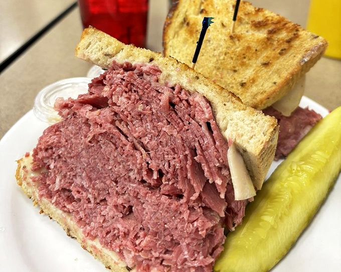 This isn't just a sandwich&mdash;it's an engineering marvel. The corned beef is stacked so high it needs its own area code and possibly structural support.