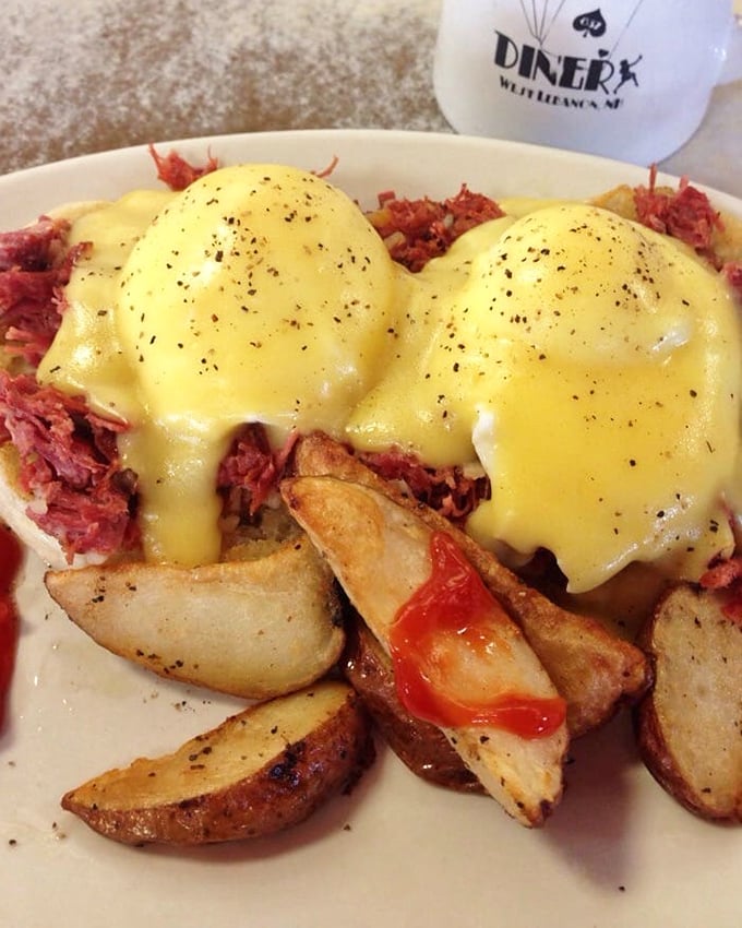 Eggs Benedict with corned beef hash&mdash;where hollandaise sauce cascades down like a yellow waterfall of happiness onto a mountain of savory perfection.