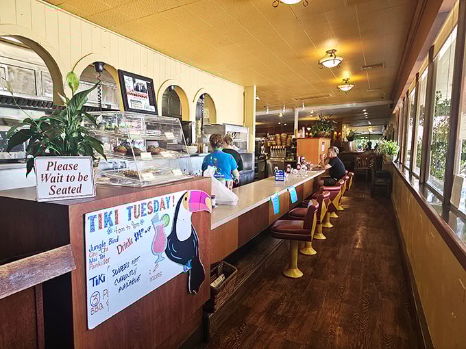 The counter area offers front-row seats to the culinary show, where "Please Wait to be Seated" isn't just a sign but a promise of good things to come.