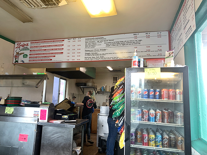 Behind this simple counter, sandwich artists craft edible masterpieces with decades of practiced precision and care.