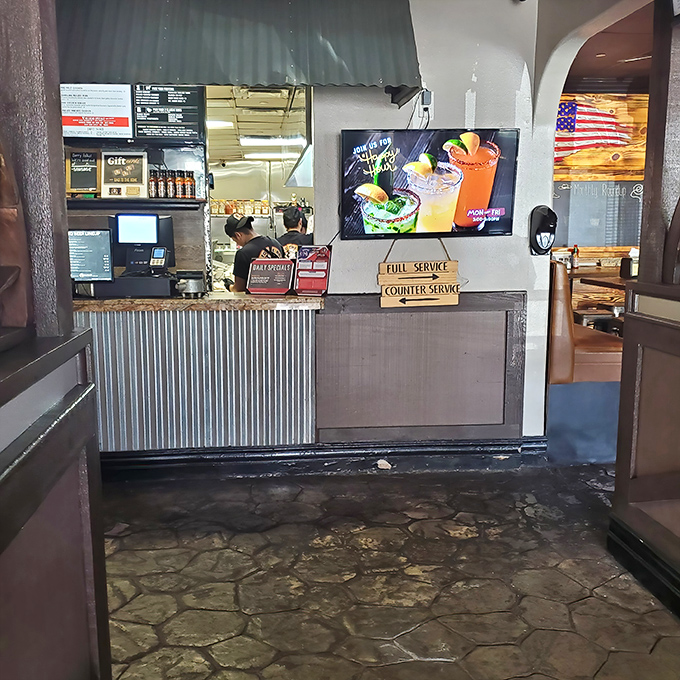 Where barbecue dreams begin their journey from order to plate. That corrugated metal front has witnessed countless expressions of anticipation.