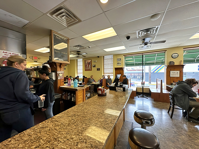 The counter view &ndash; where breakfast dreams materialize before your eyes and coffee cups never stay empty for long.