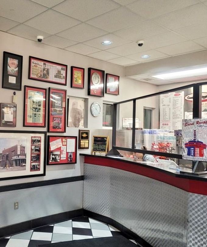 The counter area showcases decades of history on the walls. Each framed article tells a story of Cincinnati's love affair with its signature dish.