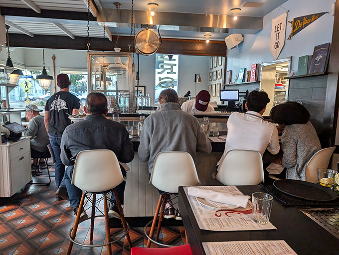 The counter seats offer front-row tickets to the culinary show. Sometimes the best dining companions are the strangers sharing your appreciation for seafood excellence.