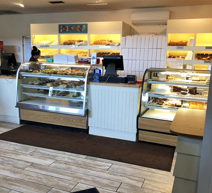 The donut counter—where willpower goes to die and happiness begins. Resistance is futile, but who's complaining?