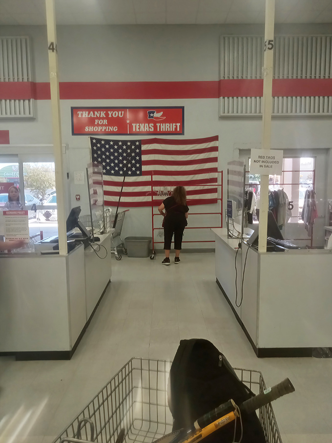 The checkout experience, complete with American flag backdrop&mdash;because finding that perfect vintage tee is practically patriotic.