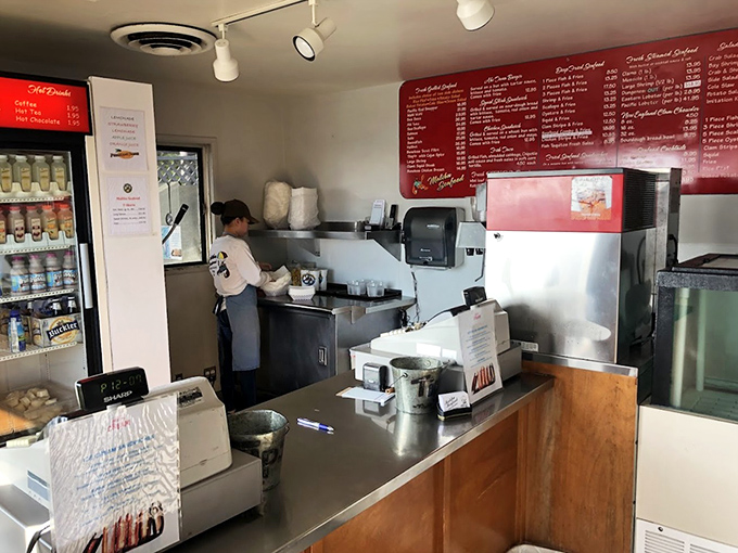 Where the magic happens. No fancy kitchen theatrics, just efficient seafood preparation that respects the ingredients.