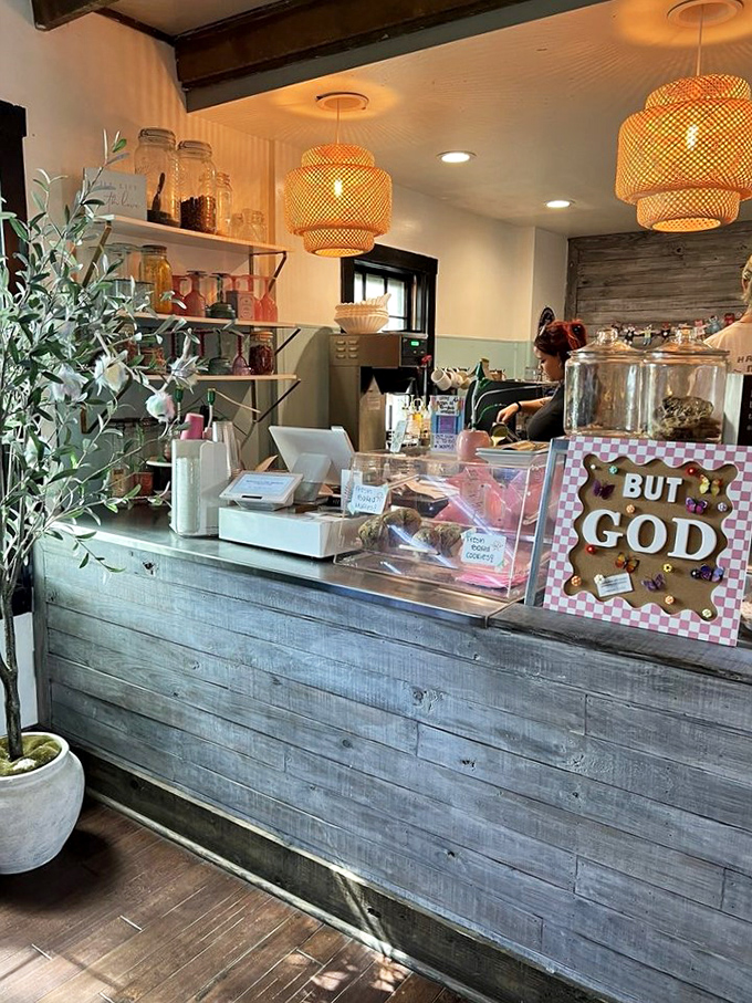Rustic meets refined at the counter, where woven pendant lights cast a warm glow over pastries that whisper sweet nothings to waiting customers.