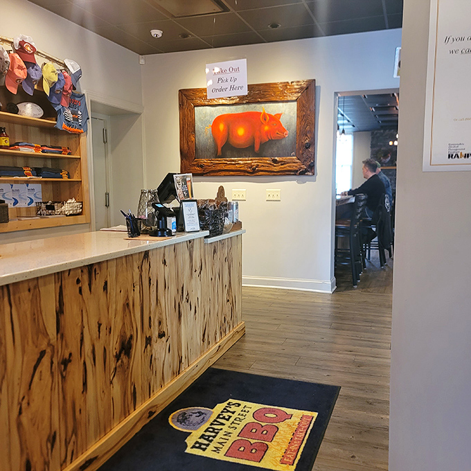 The reception area doubles as barbecue mission control. That pig painting isn't just art – it's a tribute to the noble animal that makes it all possible.